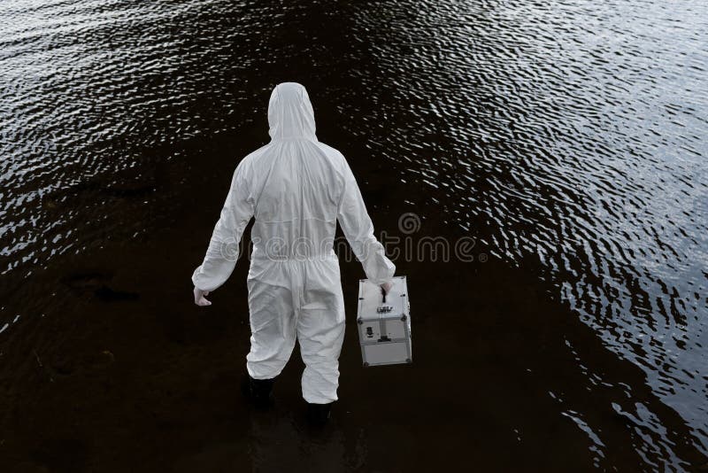 View of Water Inspector in Protective Costume Holding Inspection Kit in ...