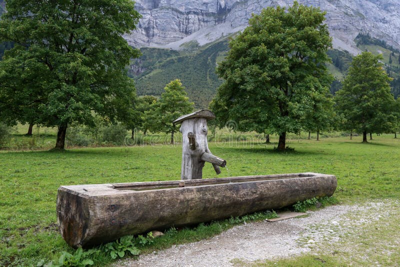 View of a Well and Water Trough Made Out of Tree Trunk in the Alps ...