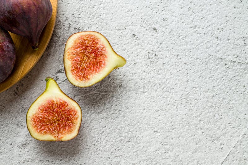 View of Whole and Cut Organic Figs on Stone Table Stock Image - Image ...