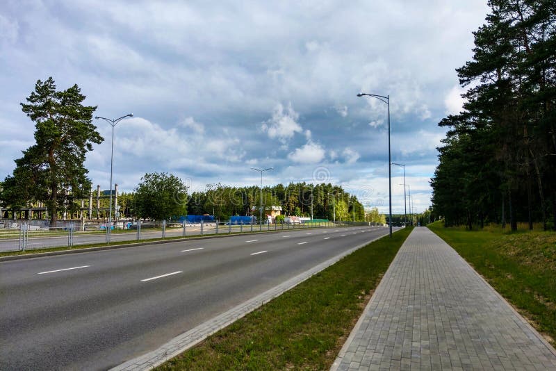 View of a Wide Empty Road with Trees on the Side of the Road Stock ...