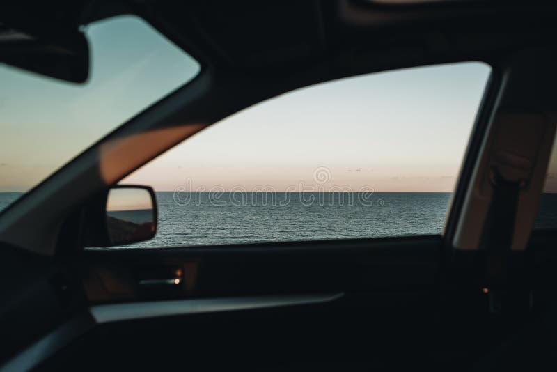 View through Window of the Car on the Sea Landscape at Sunset Stock ...