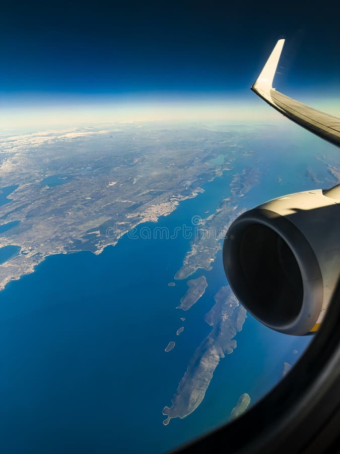 View from the Window of a Flying Plane Over the Ocean Stock Image ...