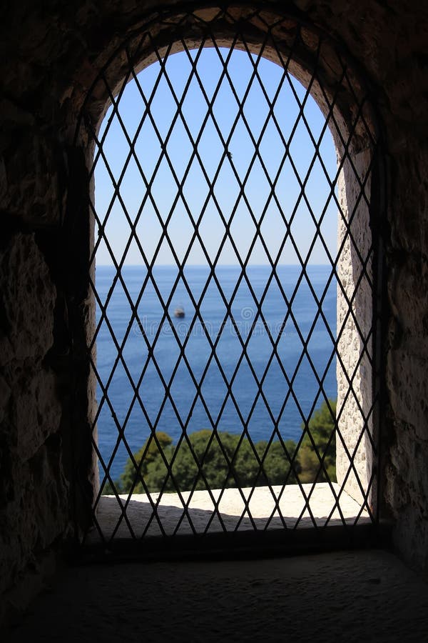 Window with Bars in the Stone Wall Stock Photo - Image of fort, dark ...