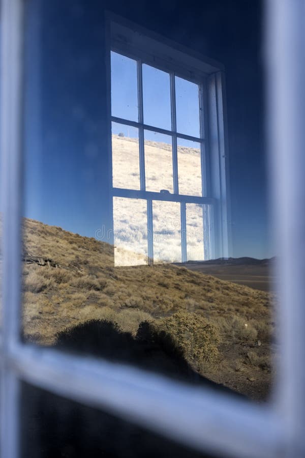 View of a Window Frame through a Window with a Desert Reflection Scene ...
