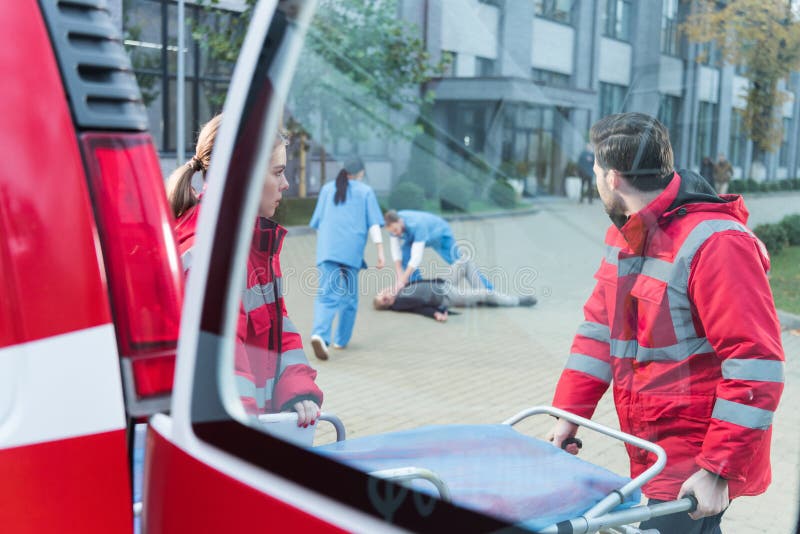 View through Window of Paramedics Helping Stock Photo - Image of ...