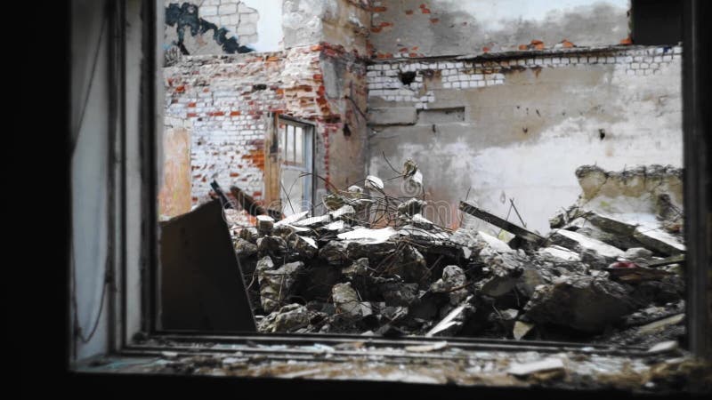 View through the Window on the Rebar in a Bombed-out Abandoned House ...
