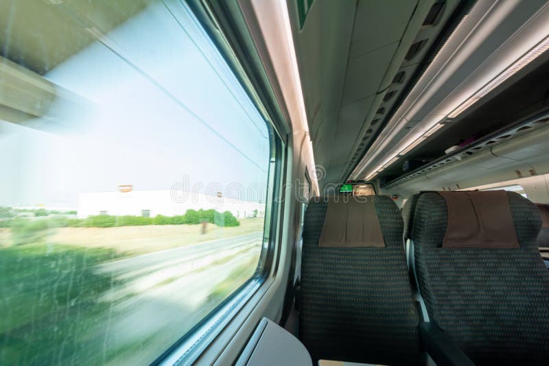View of a Window Scrolling the Landscape Inside High Speed Train Stock ...