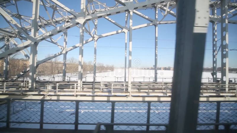 View from Window of Train Moving Over Frozen River Stock Video - Video ...