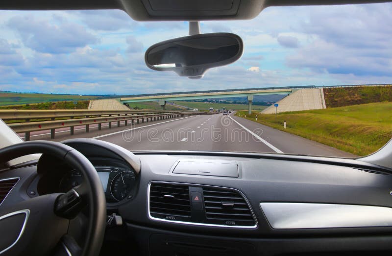 View from the Windshield of a Car Driving Along a Sunset Road Stock ...