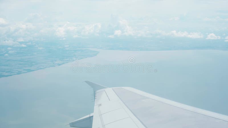 View of a Wing of a Flying Airplane Changing Direction. Stock Video ...