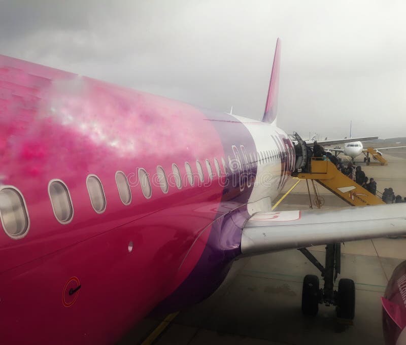 View of the Wing of the Plane Taking Off through the Window, from the ...