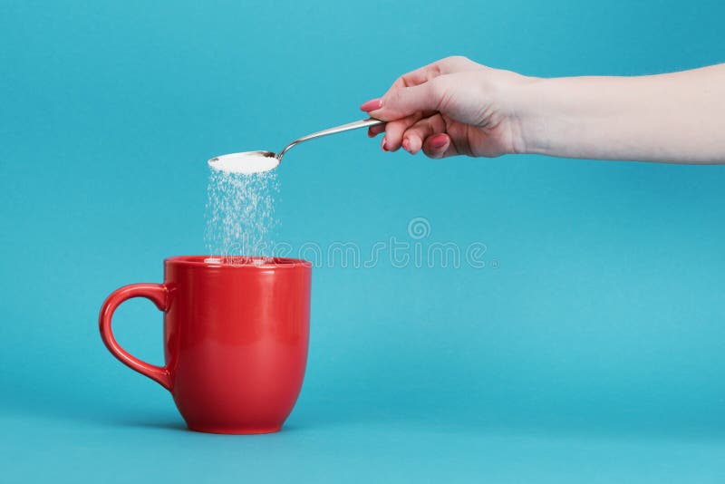 View of Woman Adding Sugar into Red Cup on Blue Background Stock Image ...