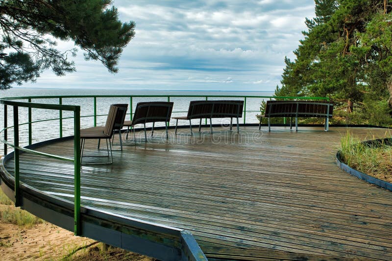 A View of a Wooden Platform with Several Wooden Benches Overlooking ...