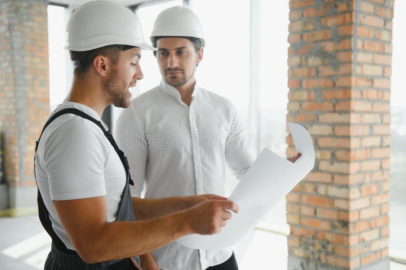 View of a Worker and Architect Watching Some Details on a Construction ...