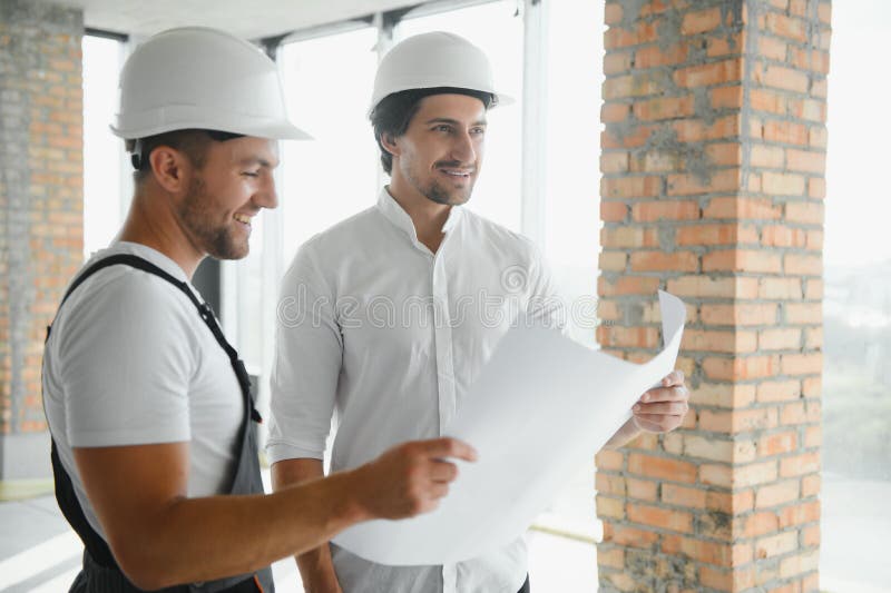 View of a Worker and Architect Watching Some Details on a Construction ...
