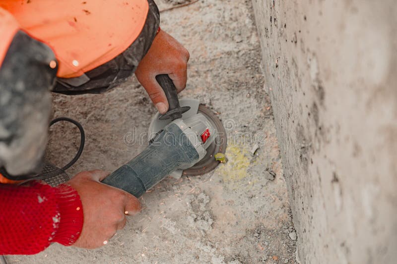 View of a Worker at a Construction Site Working with a Rock-drill and ...