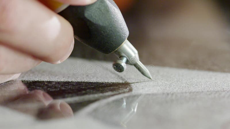 View of Worker`s Hand is Sandblasting Writing on Dark Surface of ...