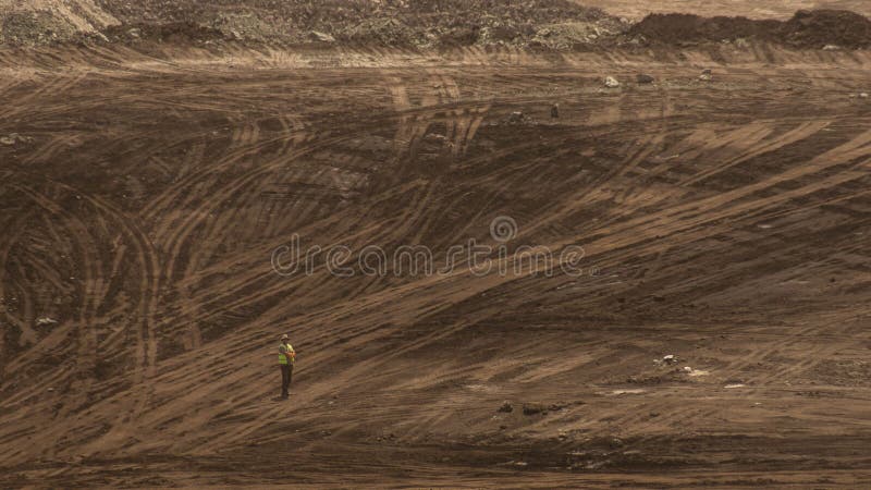 View of a Worker Standing Alone in the Deserted Field of Ptolemaida ...