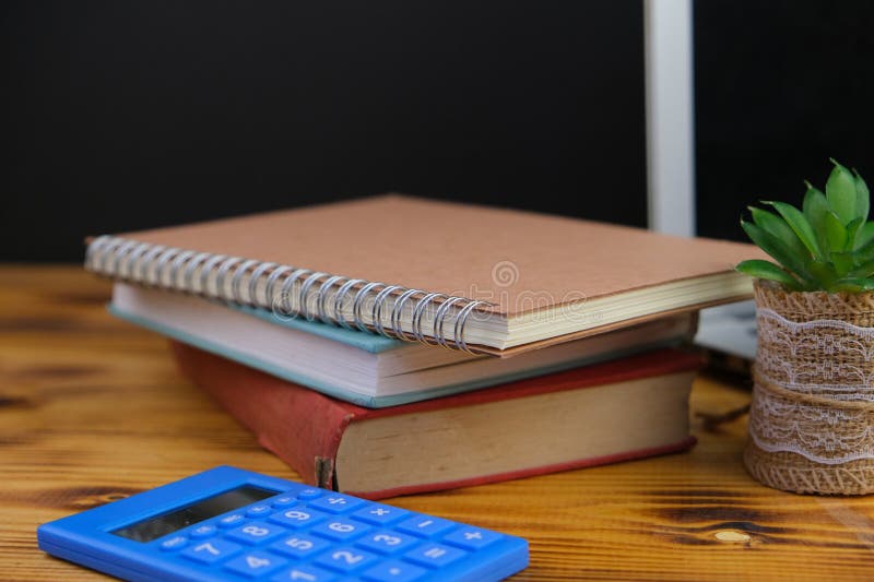 View of a Workplace with a Laptop and a Notebook, on a Wooden Table ...