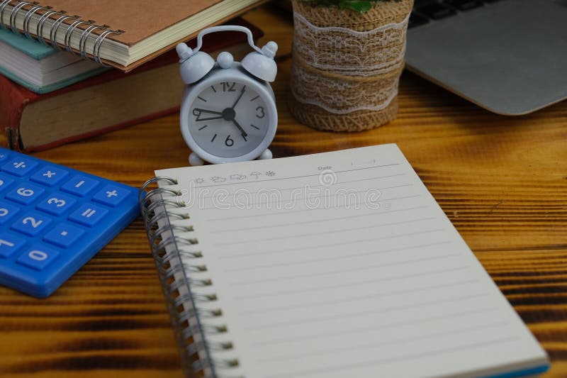 View of a Workplace with a Laptop and a Notebook, on a Wooden Table ...