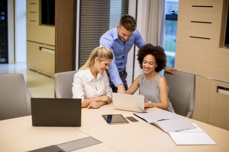 View at Young Business People Working in a Modern Office Stock Photo ...