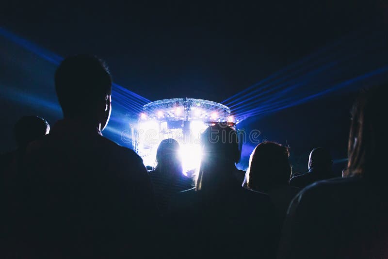 Viewers Watch a Rock Band Perform on Stage. Stock Image - Image of ...