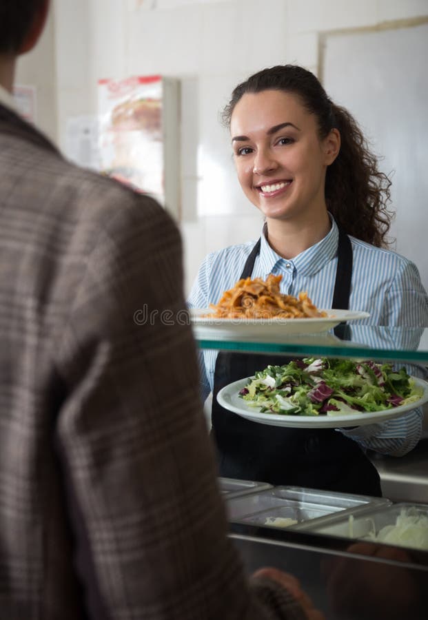 Vigorous Female Worker Serving Customer with Smile Stock Image - Image ...