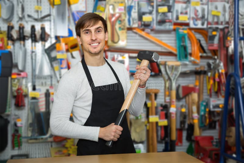 Vigorous Young Salesman in Apron with Tools Stock Photo - Image of ...