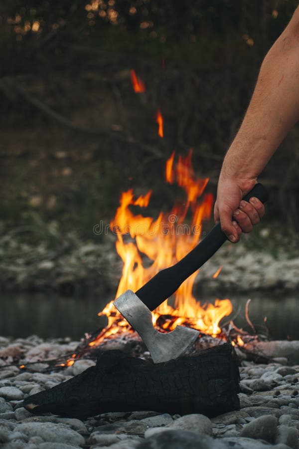 Viking Ax. an Ax Driven into a Piece of Wood. Ax in the Water Stock ...