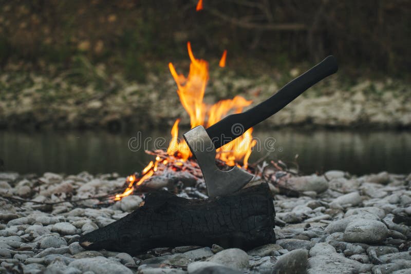 Viking Ax. an Ax Driven into a Piece of Wood. Ax in the Water Stock ...