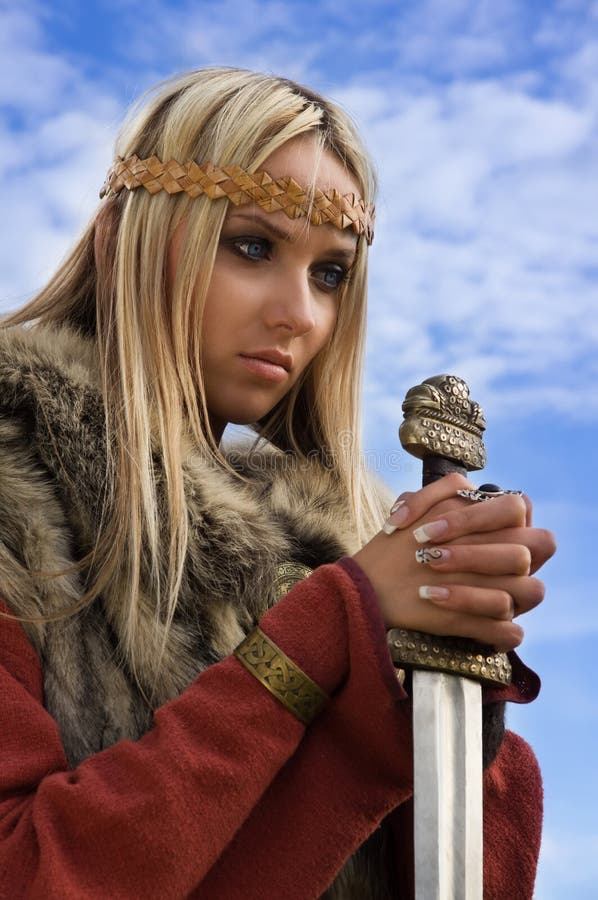 Viking Girl Warrior on a Blue Sky Background Stock Photo - Image of ...