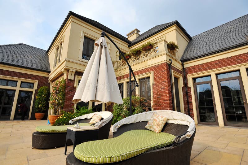 Villa Deck Chair and Umbrella Stock Image - Image of deck, family: 22271601