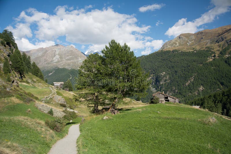 Village in the Alps stock photo. Image of clouds, forest - 63952162