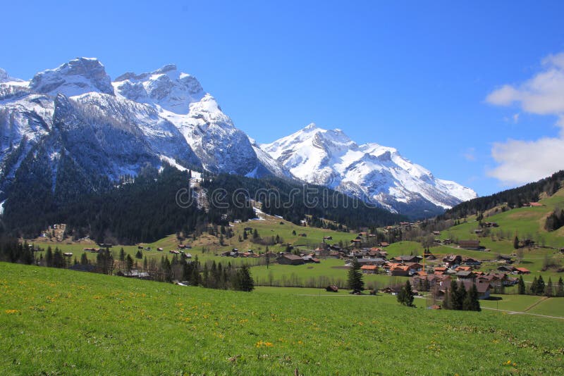 Village Gsteig Bei Gstaad and Snow Covered Mountains Stock Photo ...