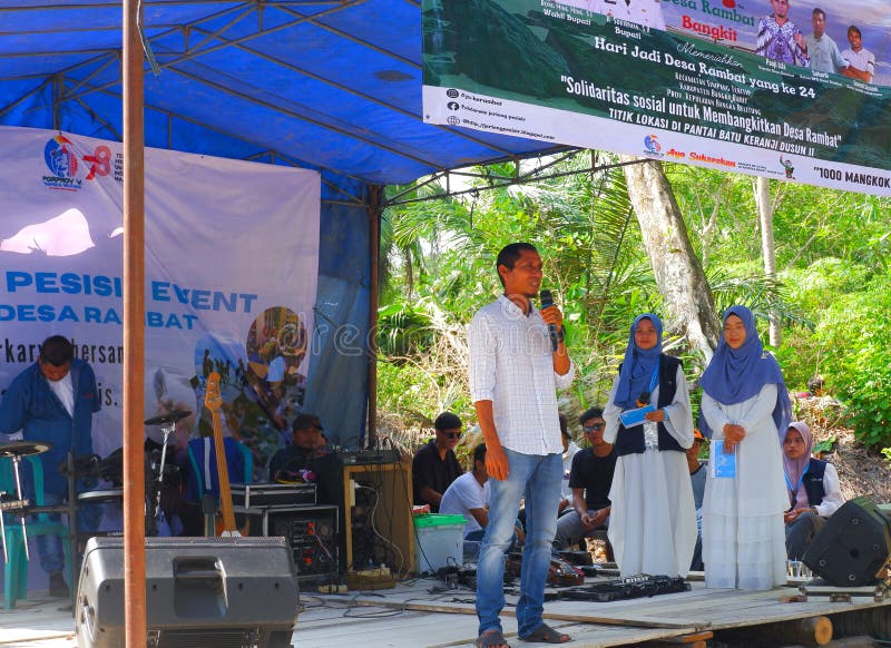 A Village Head is Speaking on Stage Using a Microphone Editorial Stock ...