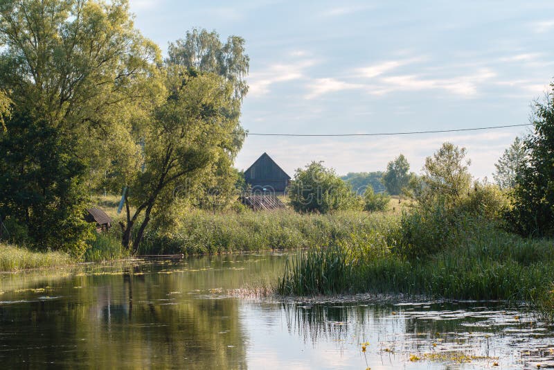 Village Houses on the River Bank Stock Image - Image of creek, banks ...