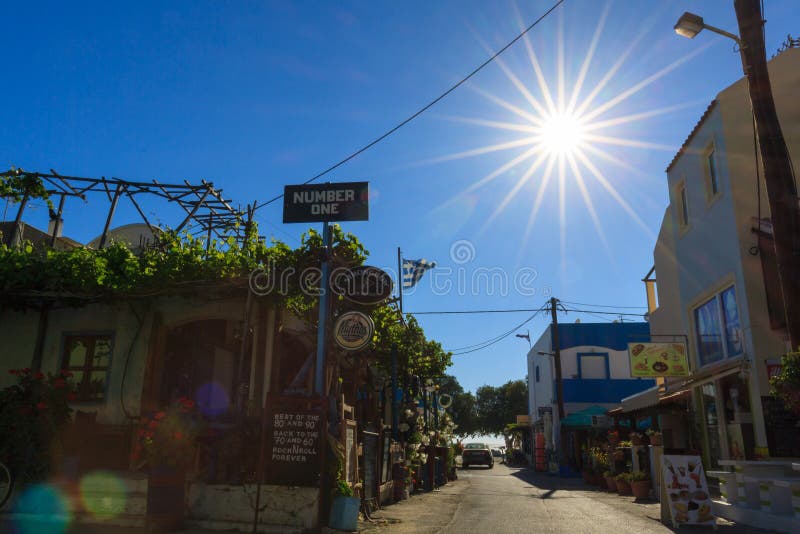 Village Street with Sun Flare Editorial Photo - Image of restaurant ...