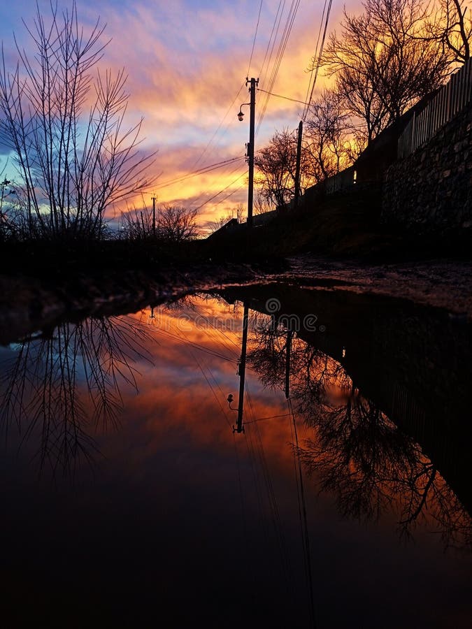 Sunset on Rain Soaked Pier,clouds Stock Image - Image of harbor, water ...