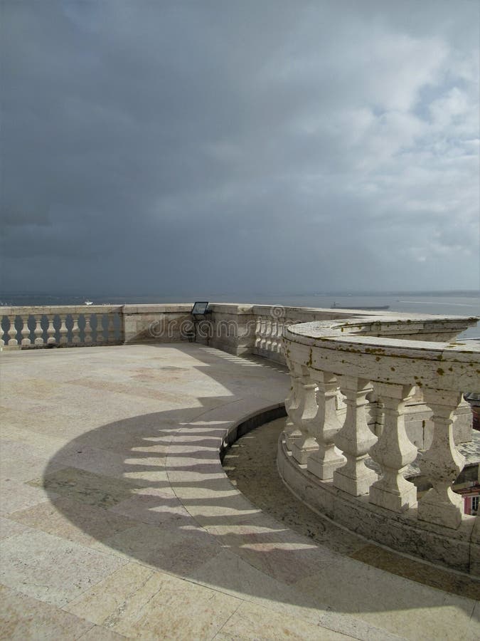 Sunlight at a White Marble Balcony before a Storm Stock Image - Image ...