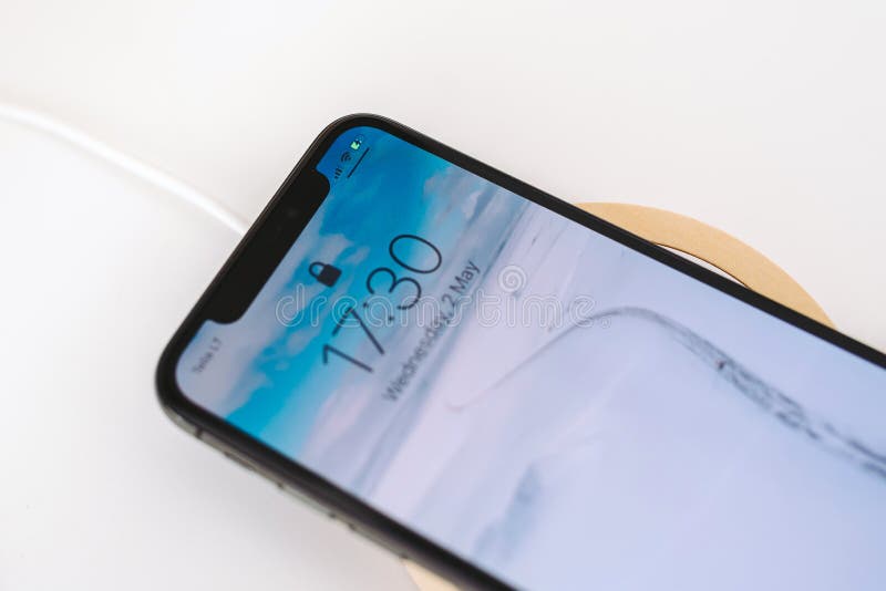 Charging IPhone X Smart Phone with Wireless Charger Editorial Photo ...