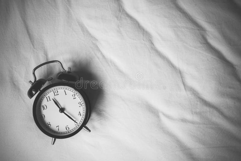 Vintage Alarm Clock on the Bed Stock Photo - Image of alarm, room: 66055226