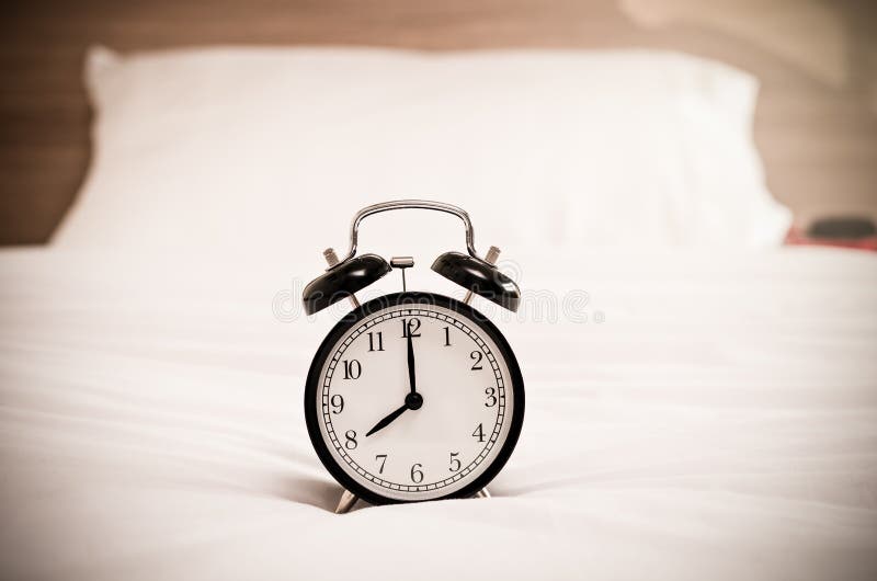 Vintage Alarm Clock on the Bed Stock Image - Image of year, morning ...