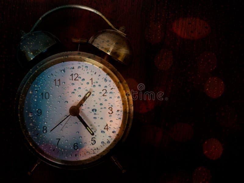 Vintage Alarm Clock on a Dark Background. Round Clock in Multi-colored ...