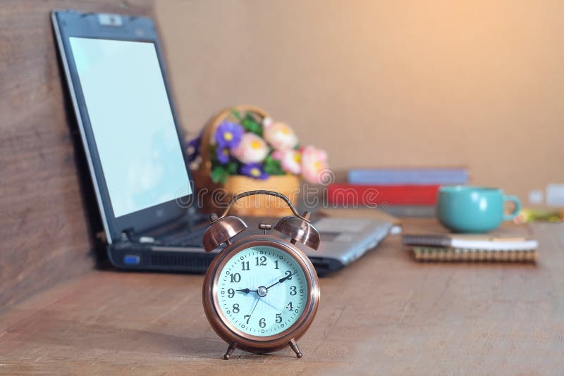Vintage Alarm Clock on Office Table and Laptop Stock Photo - Image of ...
