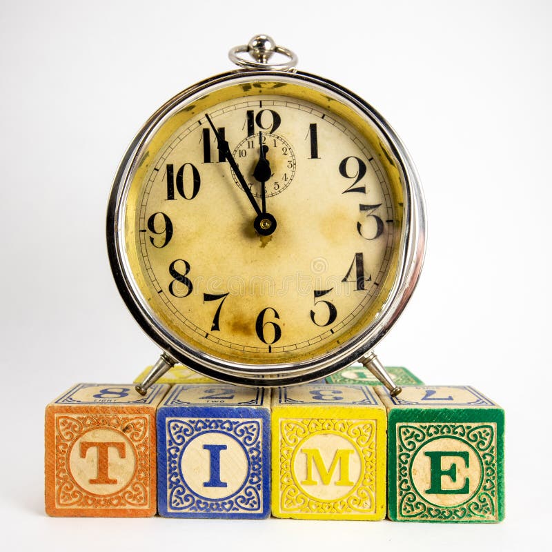 Vintage Alarm Clock on Top of Wood Blocks that Spell Time Stock Image ...