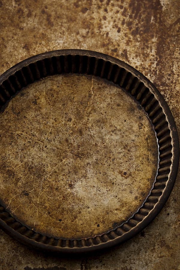 Vintage Baking Tart Form on Aged Metal Sheet Stock Photo - Image of ...