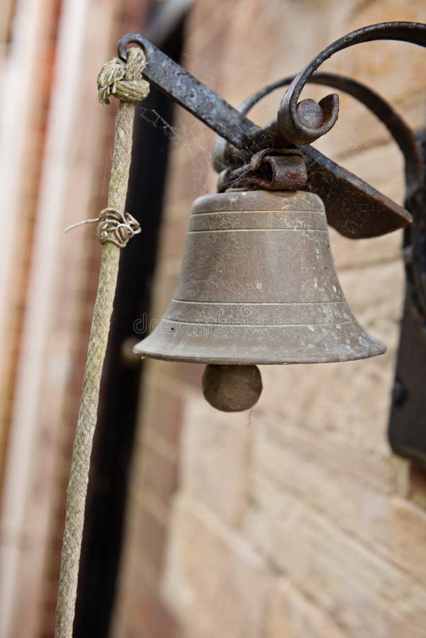 Vintage bell on stone wall stock image. Image of rustic - 34791707
