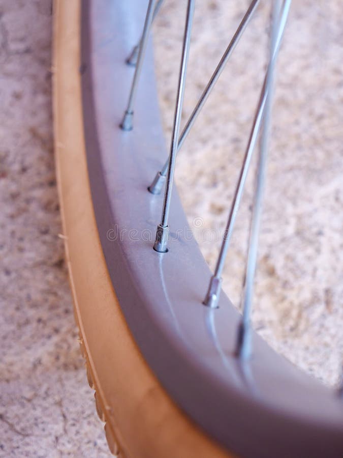 Vintage Bicycle Wheel with White Tire Resting on a Concrete Surface ...