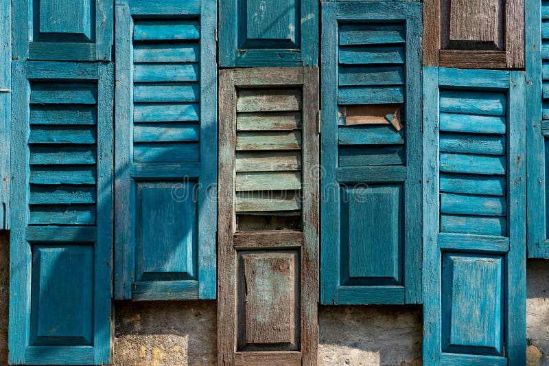 Vintage Blue Wooden Shutters of Various Styles Create a Textured, Stock ...