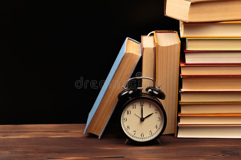 Vintage Books and Clock on Wooden Table Stock Photo - Image of literary ...